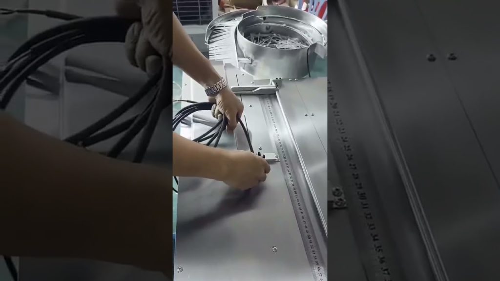 Cable strapping machine with automated nylon operation